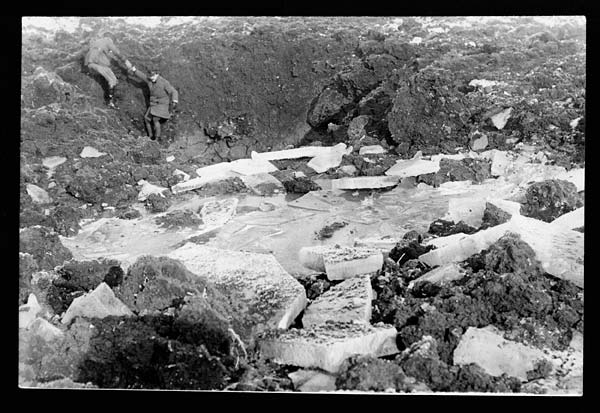(58) C.1197 - Shell holes covered with thick ice and this one has just ...